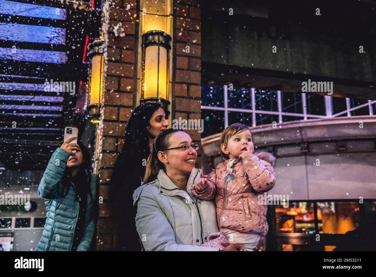 During the parade, people seen watching it from the street. Nearly a ...