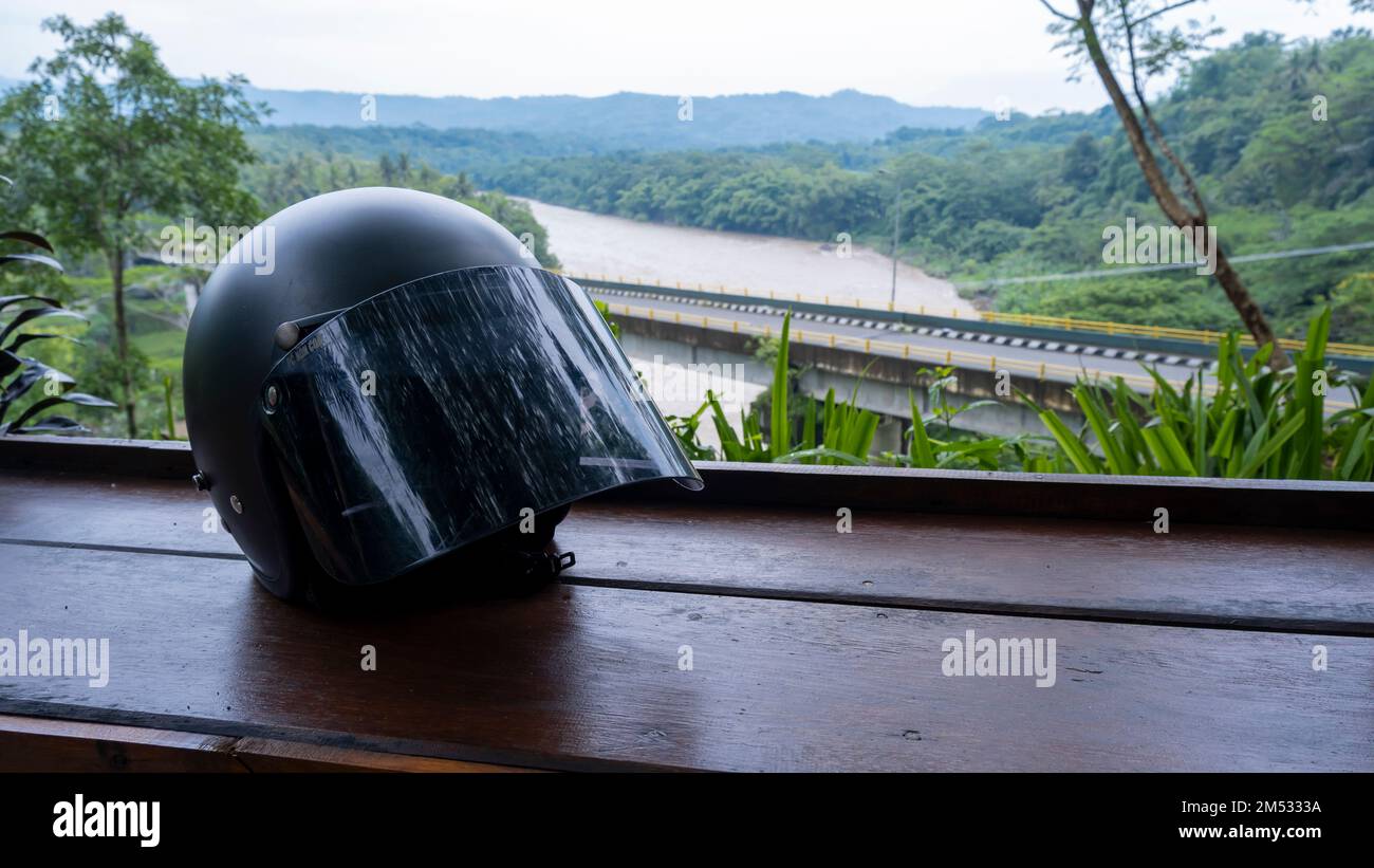 Motorcycle helmet on the table with beautiful views of bridges and ...