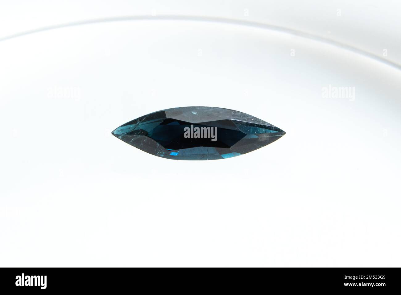 Natural mineral tourmaline indicolite blue color isolated on the white ...