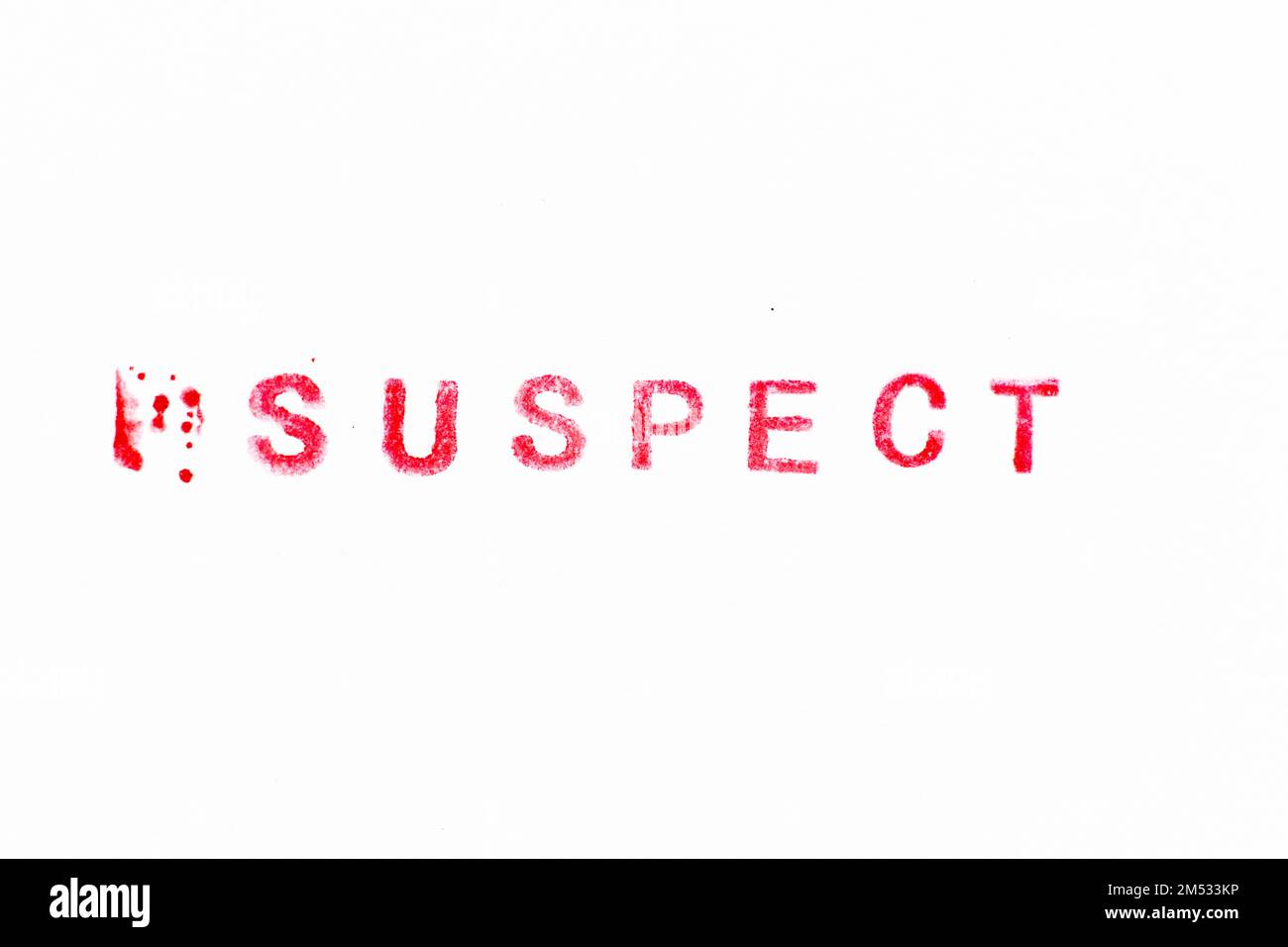 Red color ink rubber stamp in word suspect on white paper background ...