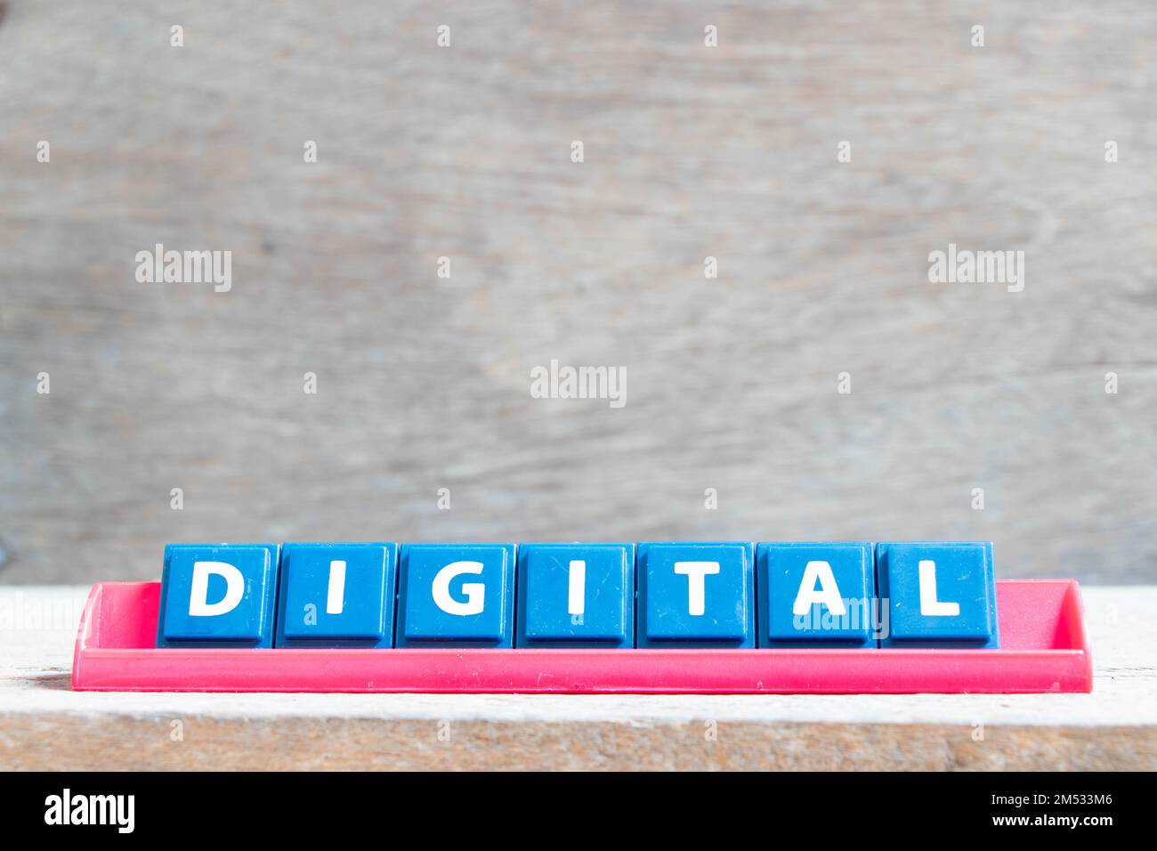 Tile alphabet letter with word digital in red color rack on wood ...