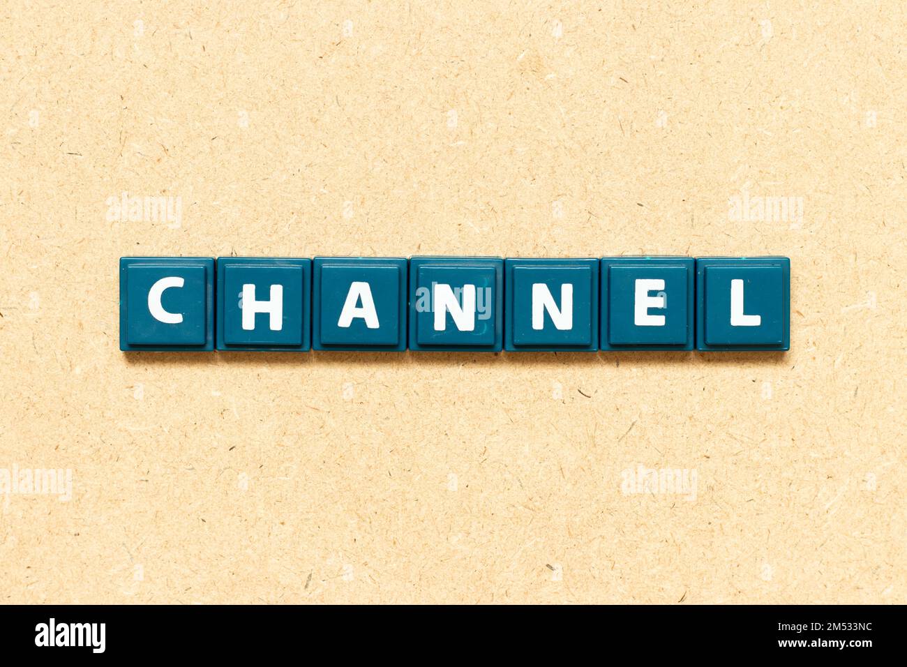 Tile alphabet letter in word channel on wood background Stock Photo - Alamy