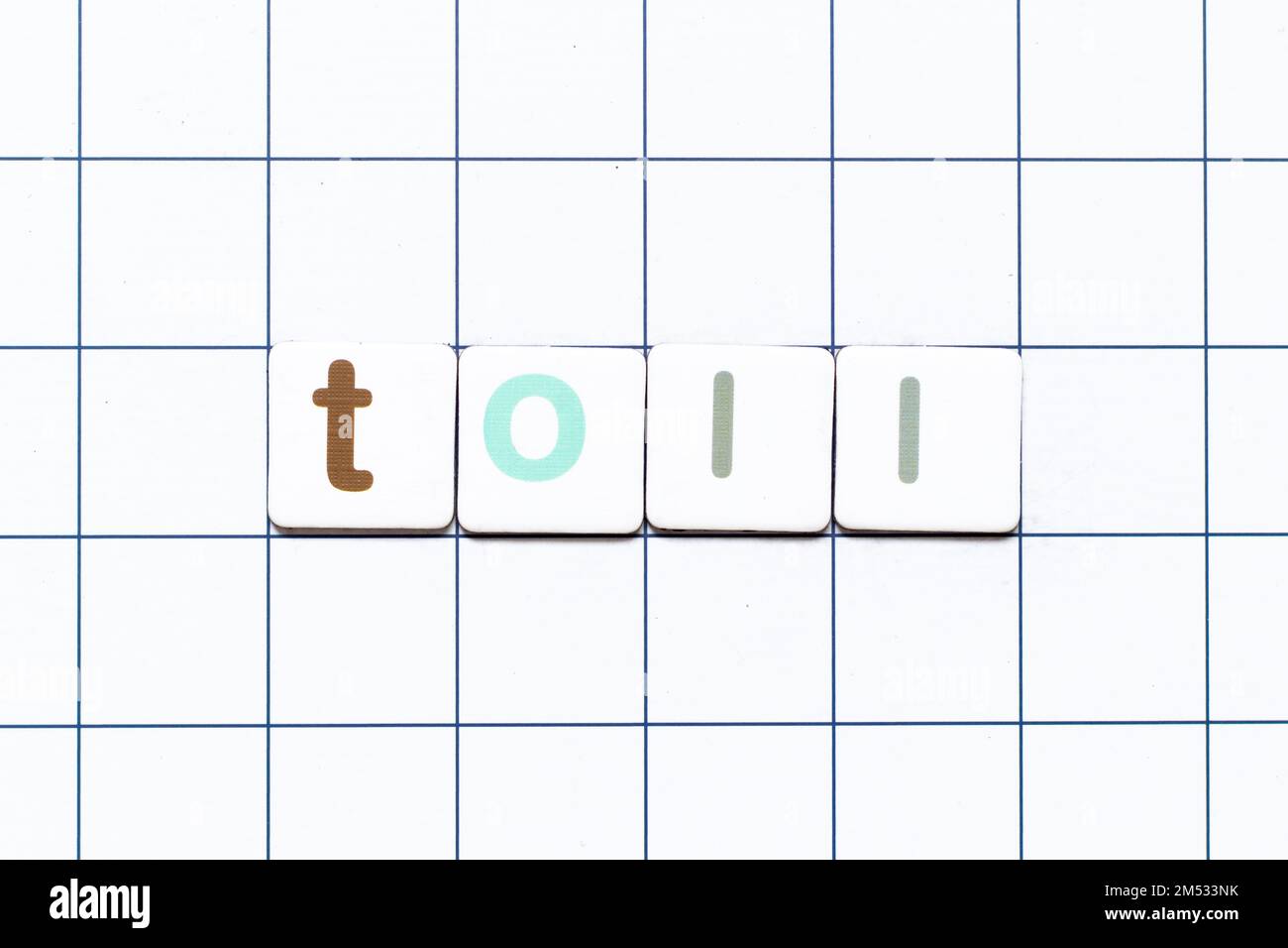 Colorful tile letter in word toll on white grid background Stock Photo ...