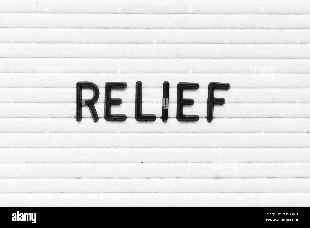 Black color letter in word relief on white felt board background Stock ...