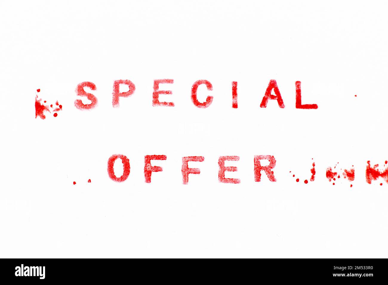 Red color ink rubber stamp in word special offer on white paper ...