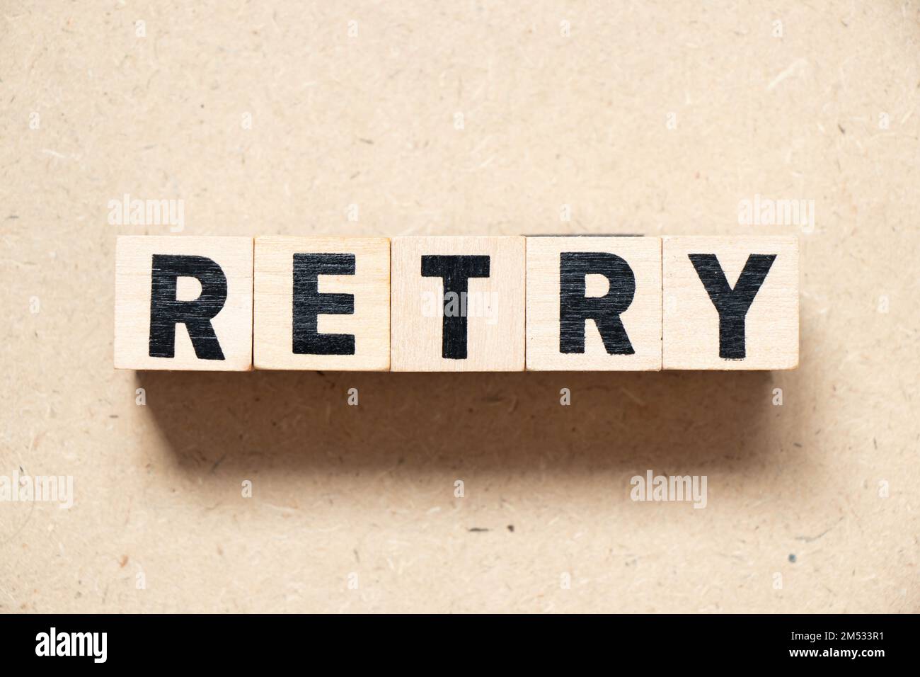 Alphabet letter block in word retry on wood background Stock Photo - Alamy