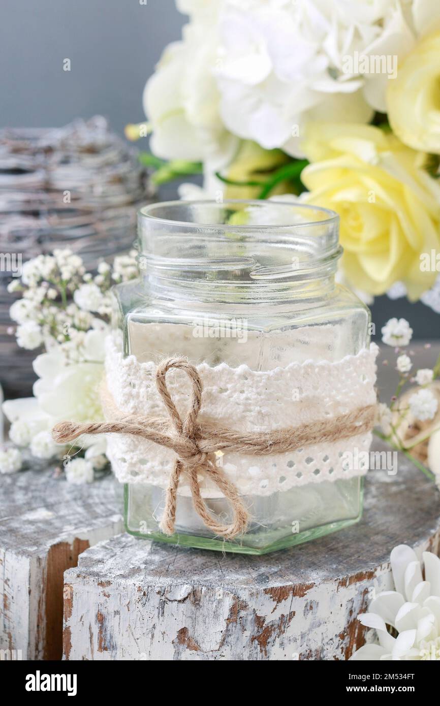 Glass jar decorated with lace and string, white pumpkins and luxurious ...
