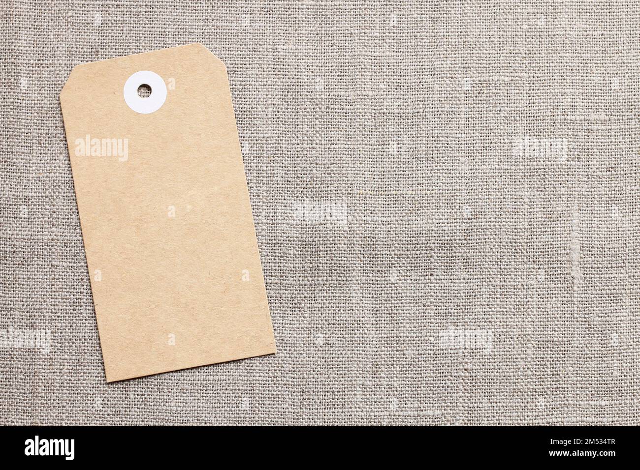 Paper price label on jute background. Copy space Stock Photo - Alamy