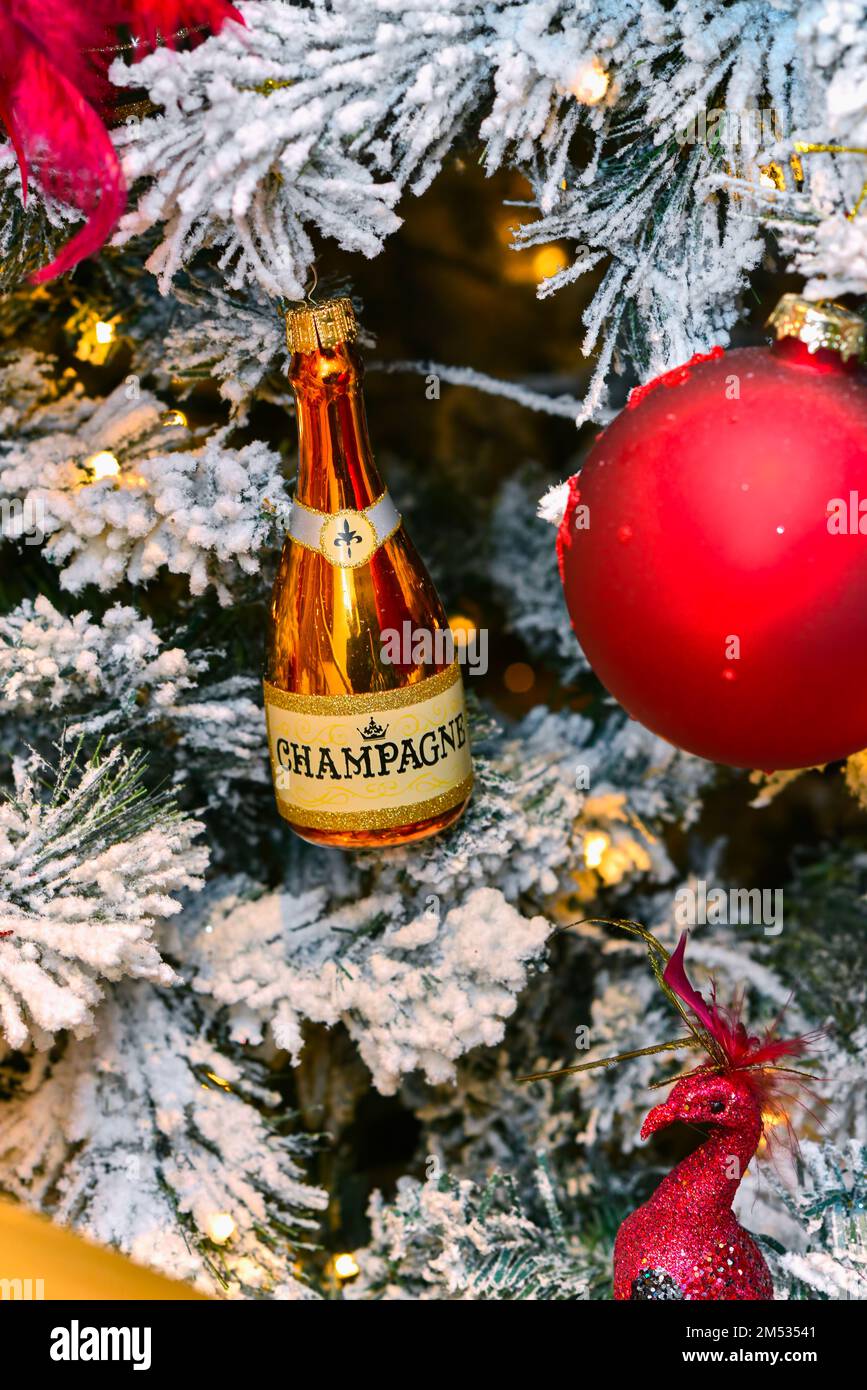 Festive Christmas decoration on a snow-covered Christmas tree with toys ...