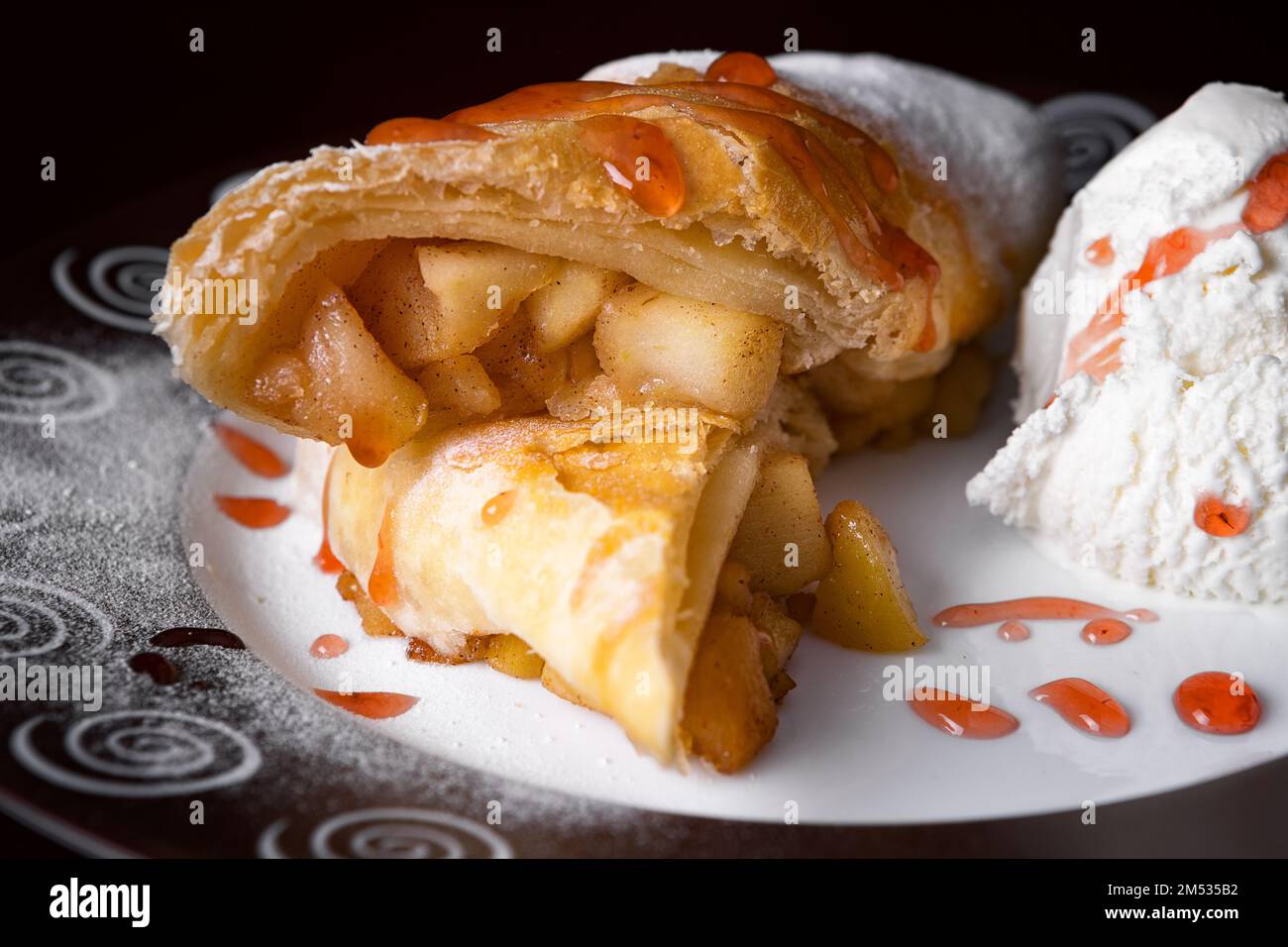 Dessert, baked strudel with apple, jam and ice cream Stock Photo - Alamy