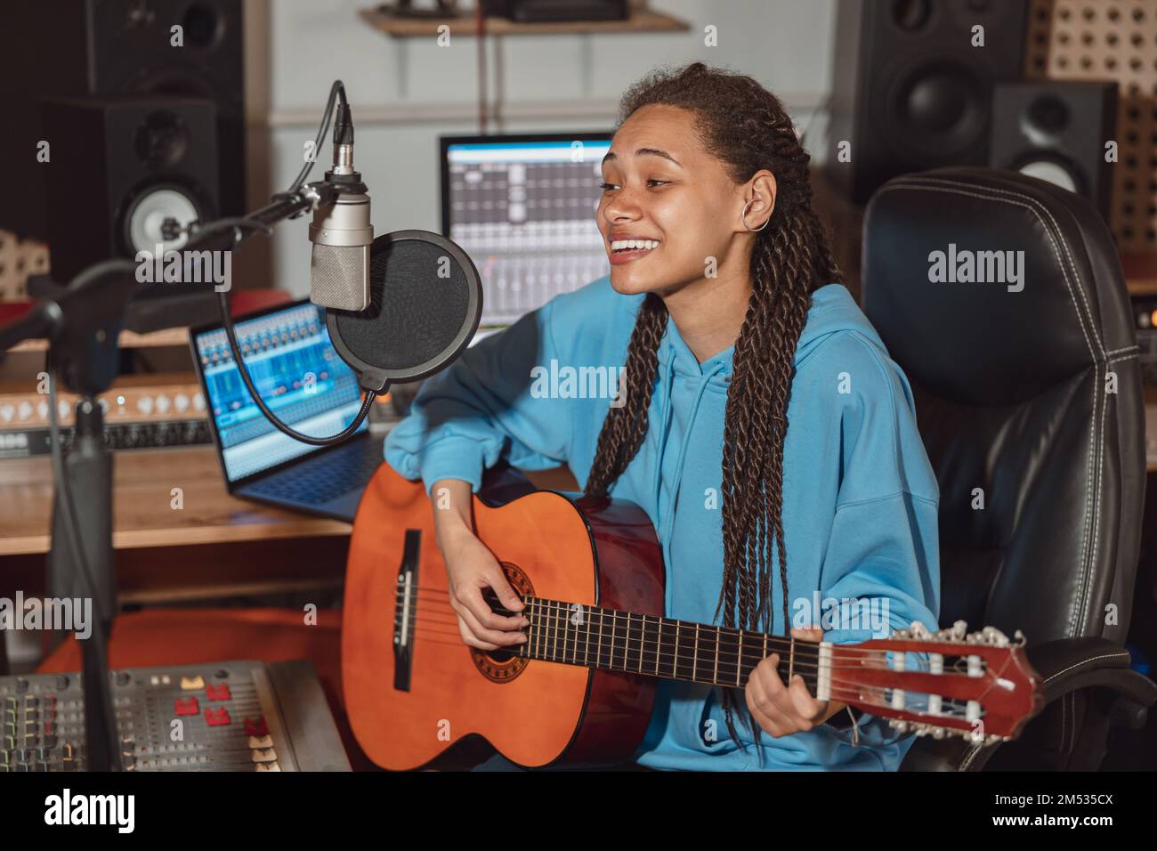 Multiracial woman, musician singer composer guitarist and songwriter ...