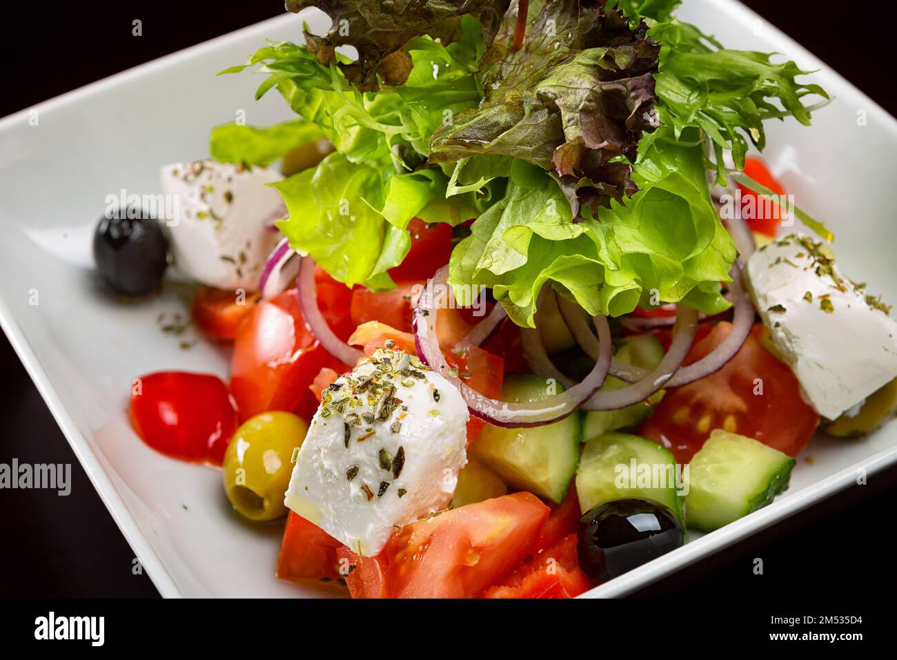 Greek salad with cheese, vegetables and olives Stock Photo - Alamy