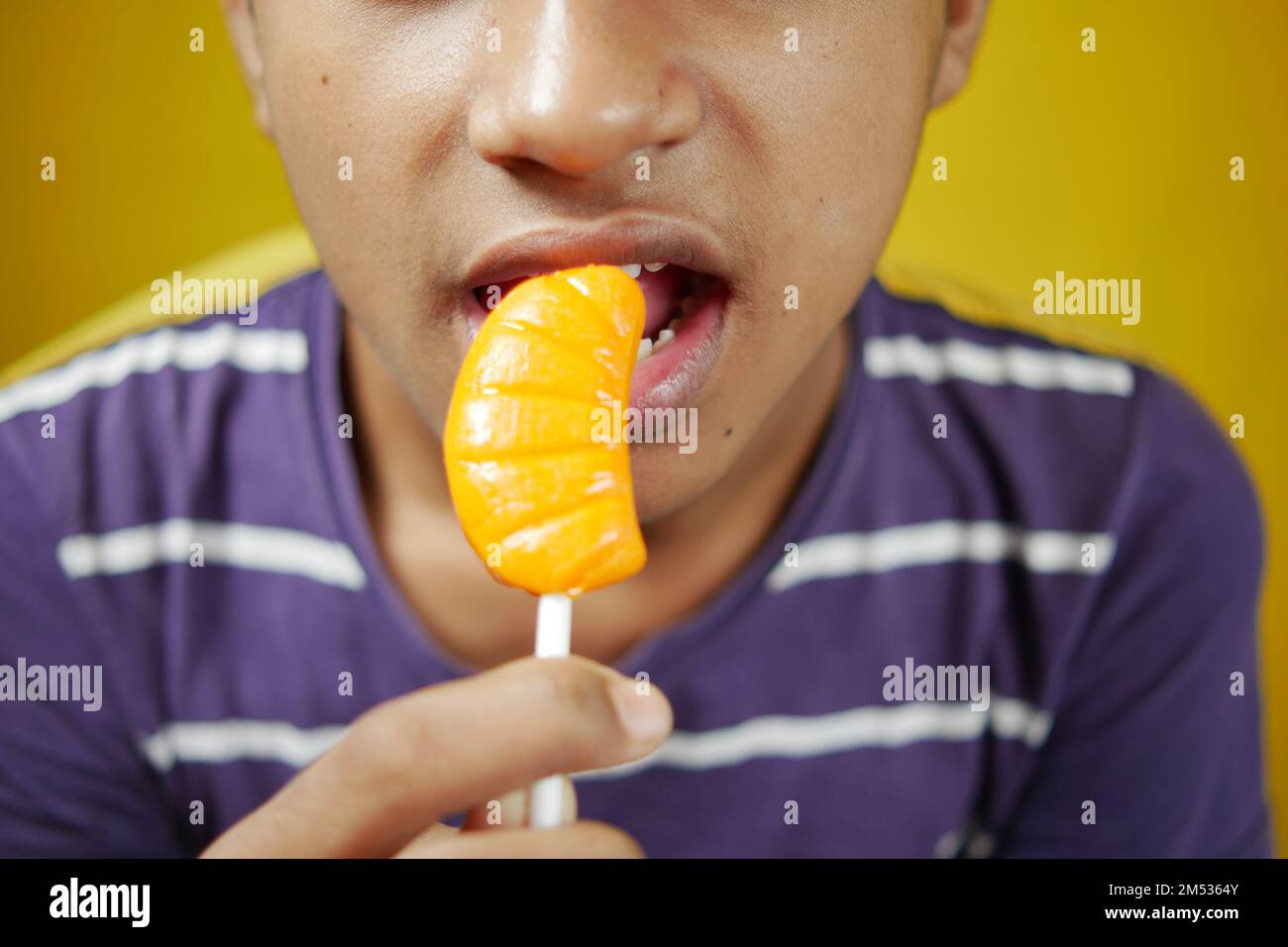 boy eating Lollipop close up Stock Photo - Alamy