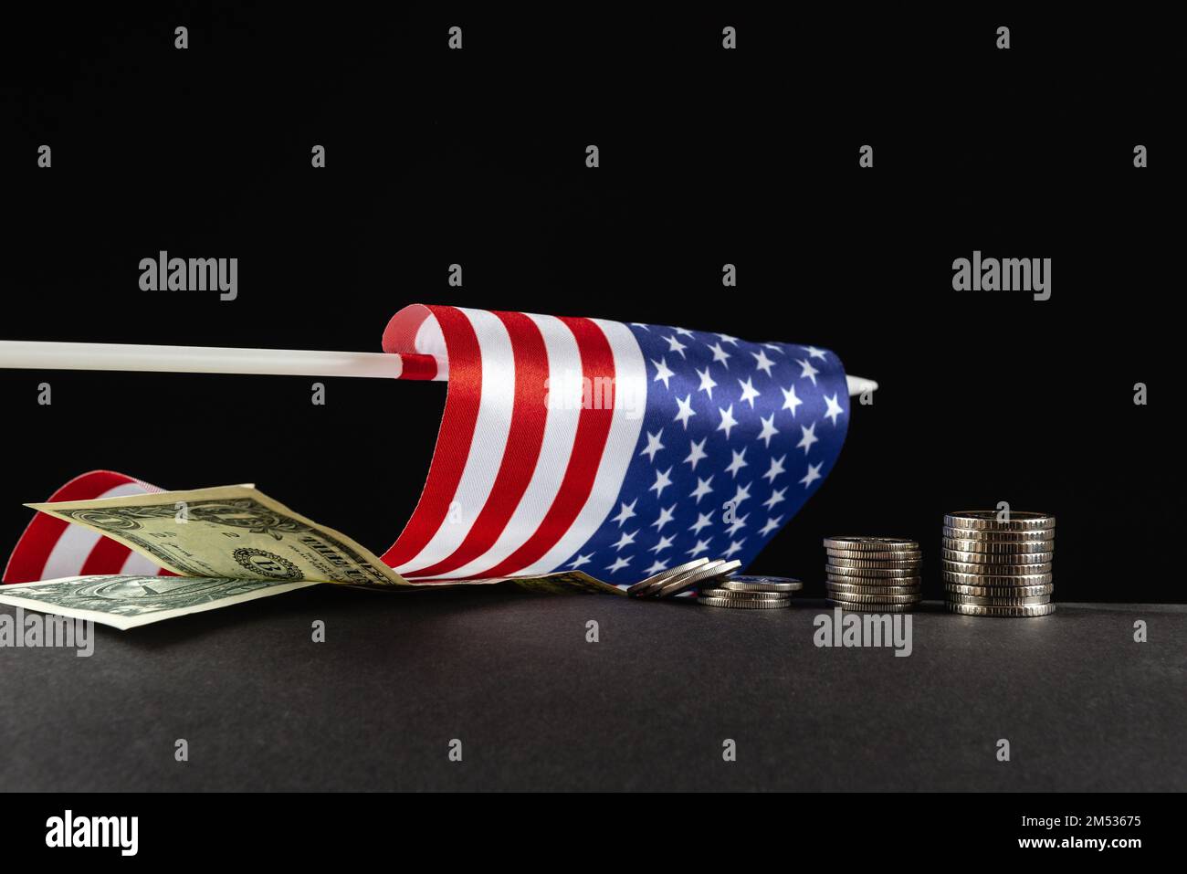 The concept of the decline of the USA economy. American flag fallen ...