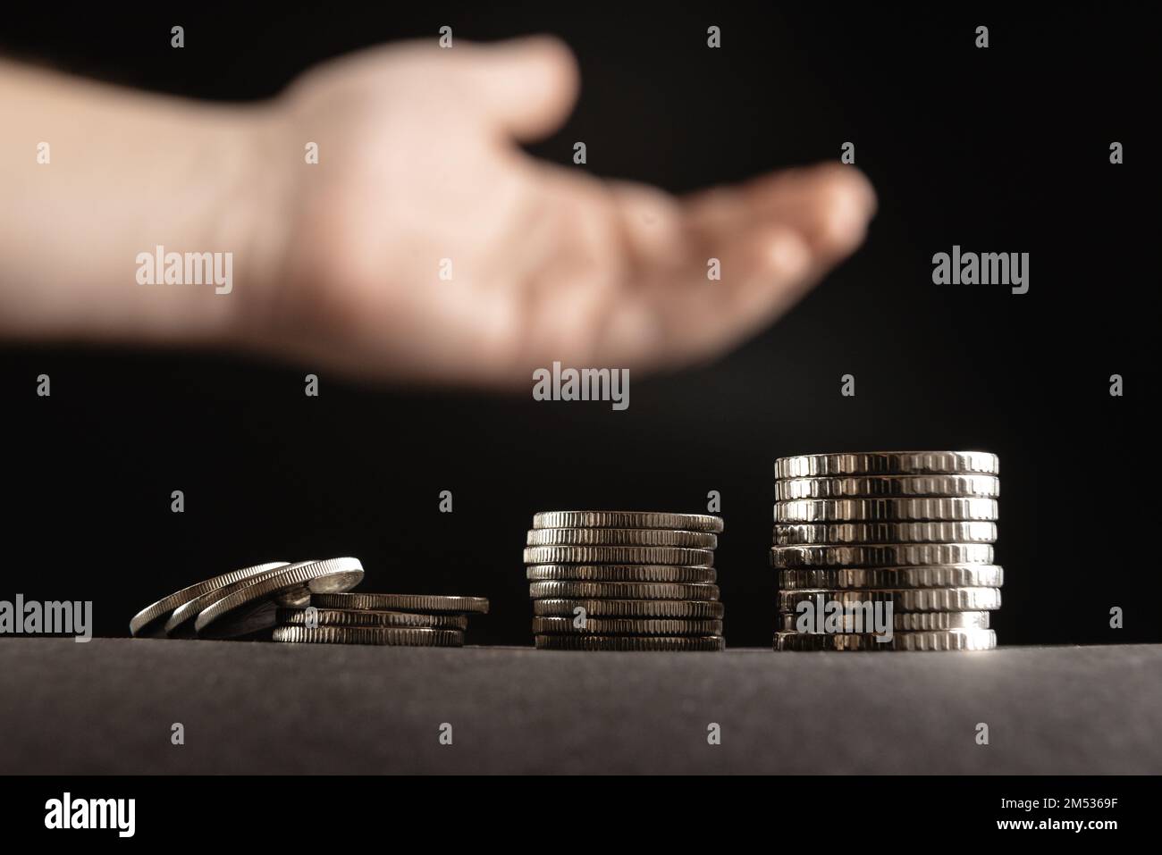 Financial Aid for the Poor. Coins and money in front of an outstretched ...