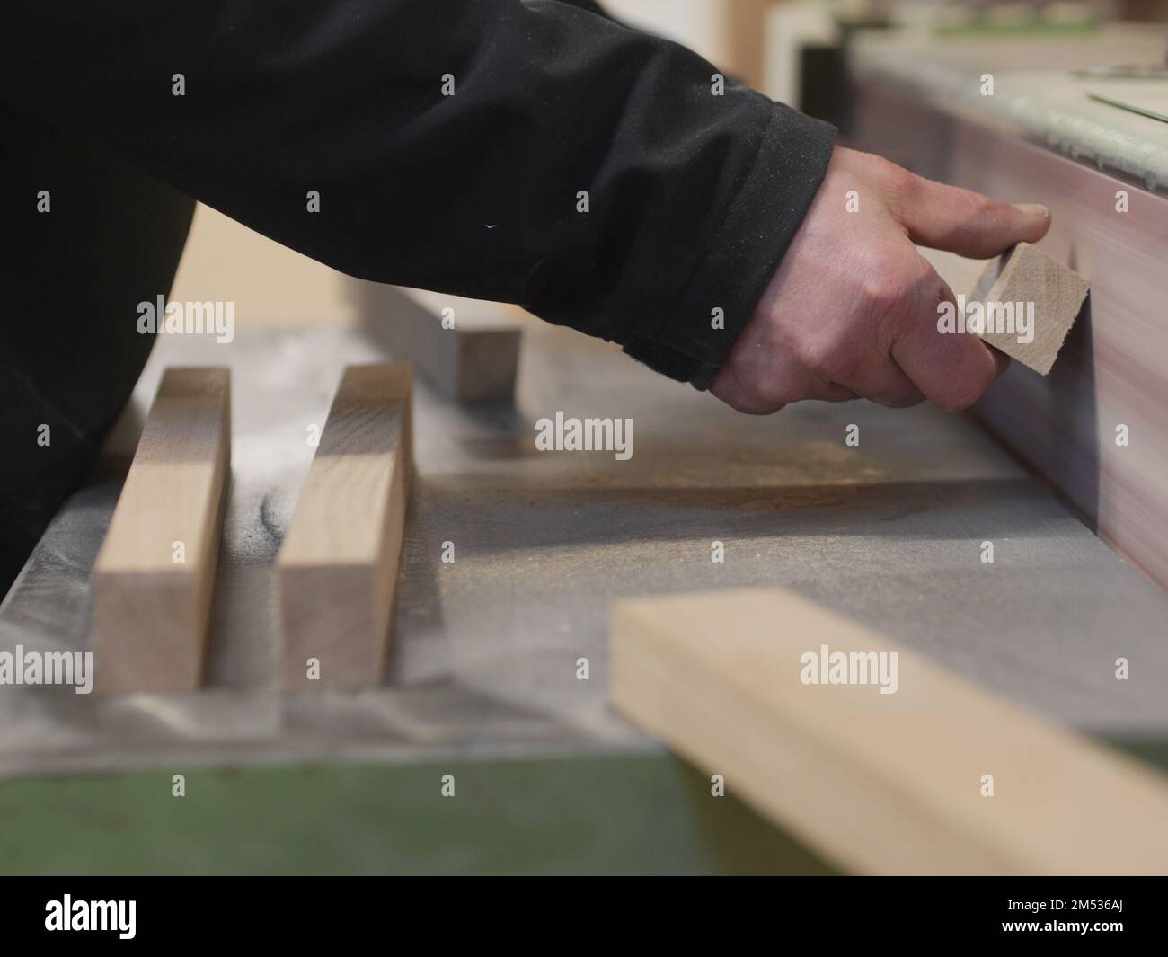 Close-up of man's hands holding small wooden plank Stock Photo - Alamy