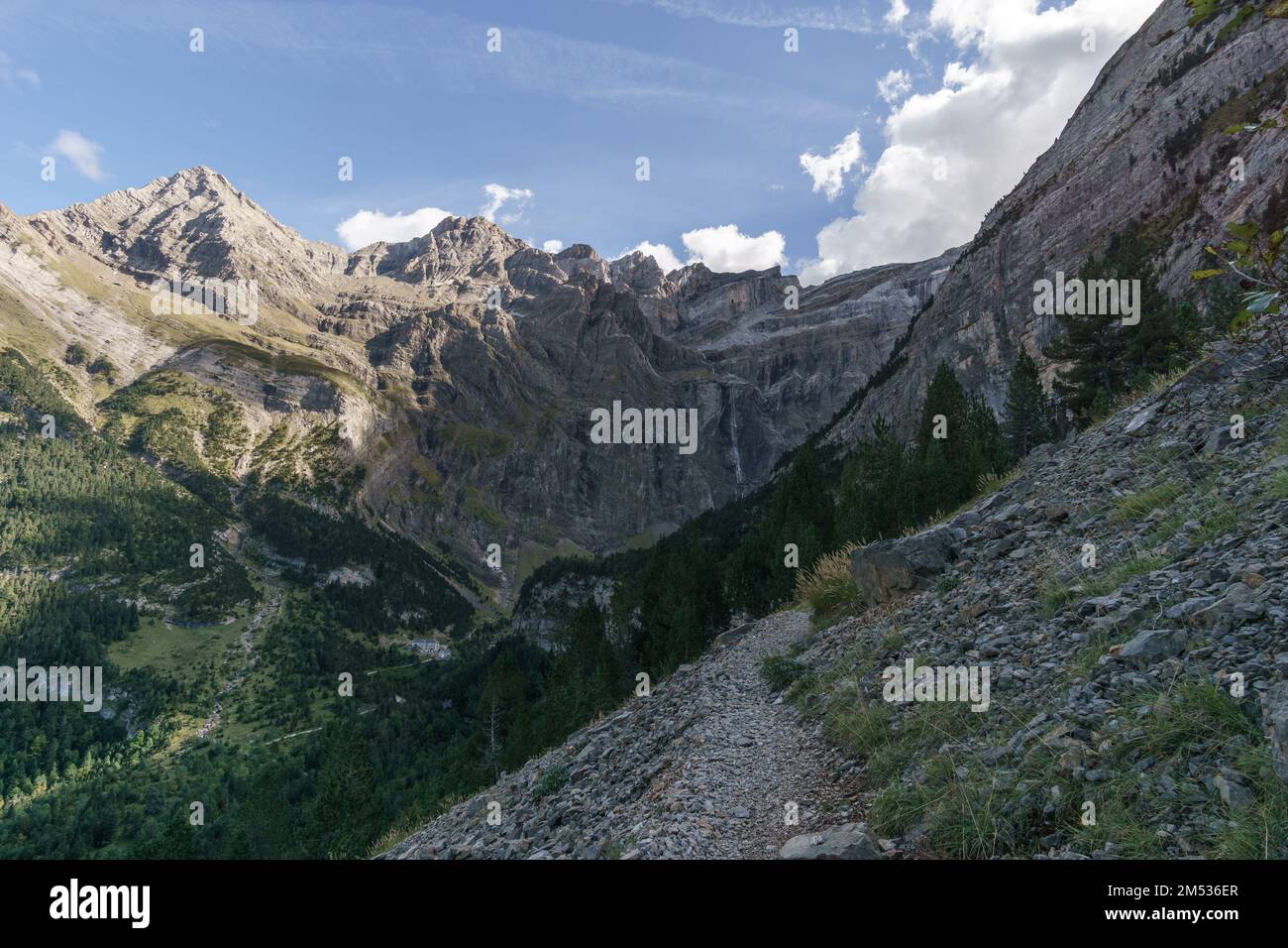 Cirque de Gavarnie with waterfall at massive high rock wall formation ...