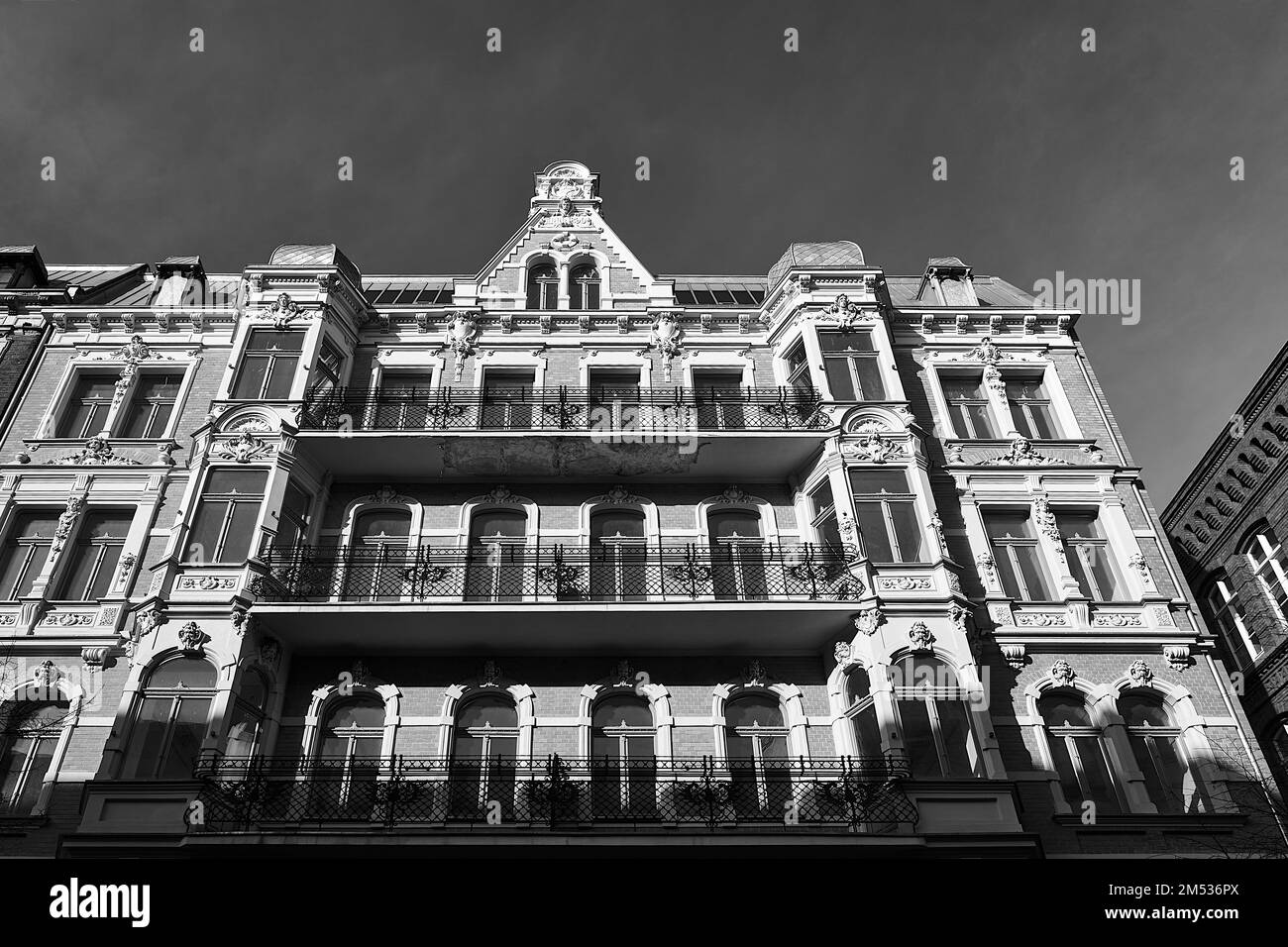 facade of historic tenement house with balconies in the city of Poznan ...