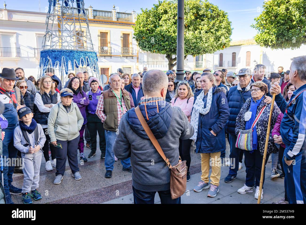 Huelva, Spain - December 4, 2022: A group of tourist starting a guided ...