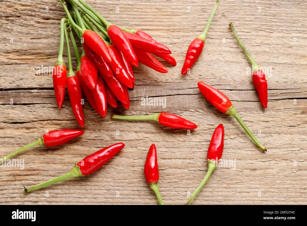 Red hot chili peppers on old wooden table. Graphic resources Stock ...