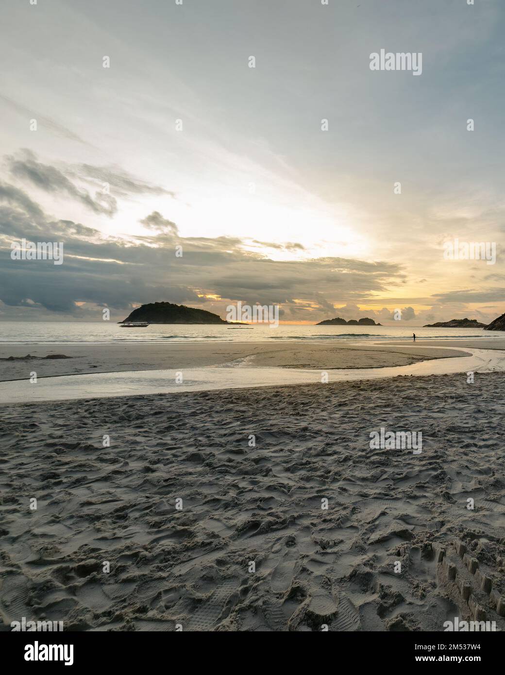 Sunrise reflections on the beach sand. Textured and watery sandy beach ...