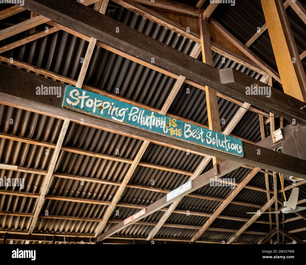 Stopping pollution is the best solution sign on the roof beam Stock ...
