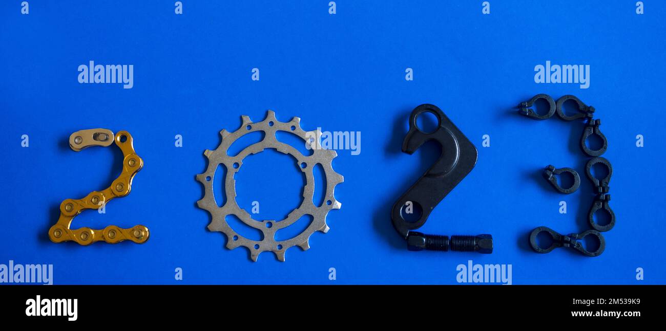 Backgrounds of 2023 number with bike parts design on blue background ...
