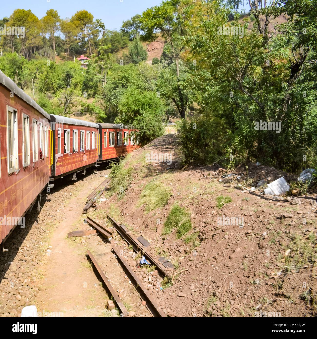 Toy Train moving on mountain slopes, beautiful view, one side mountain ...