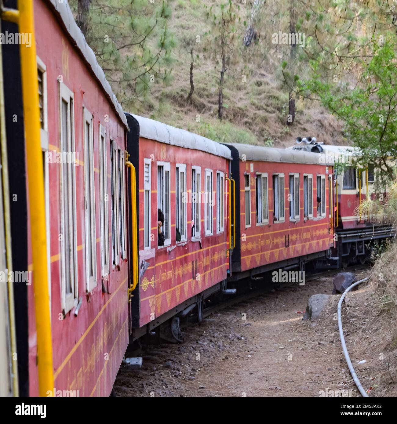 Toy Train moving on mountain slopes, beautiful view, one side mountain ...