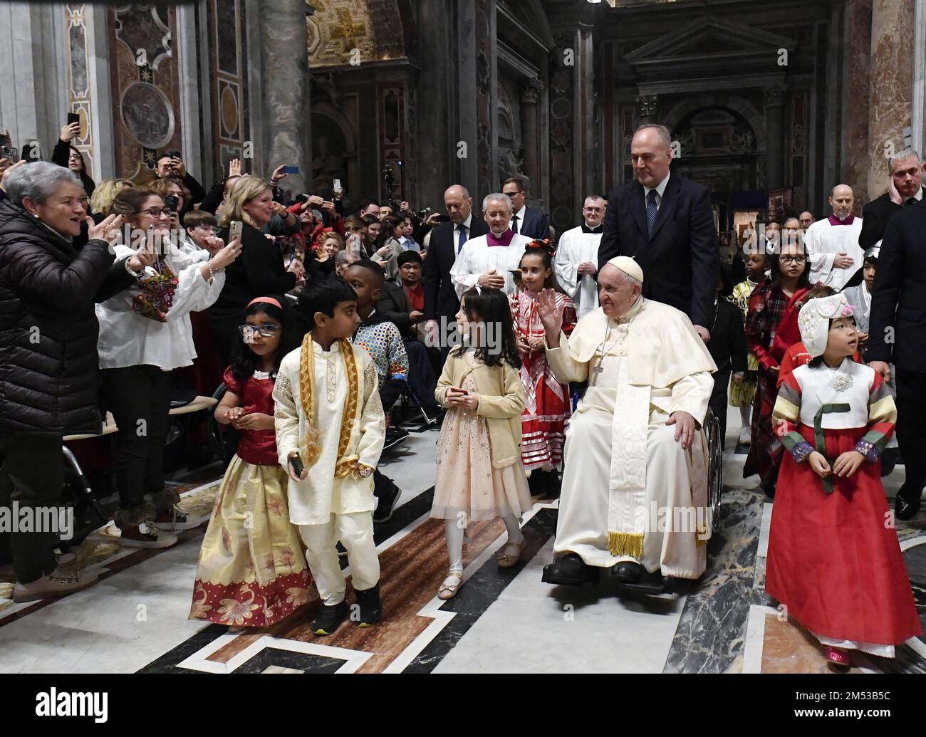 Pope Francis, in a wheel chair, celebrates the Christmas Eve mass at St ...