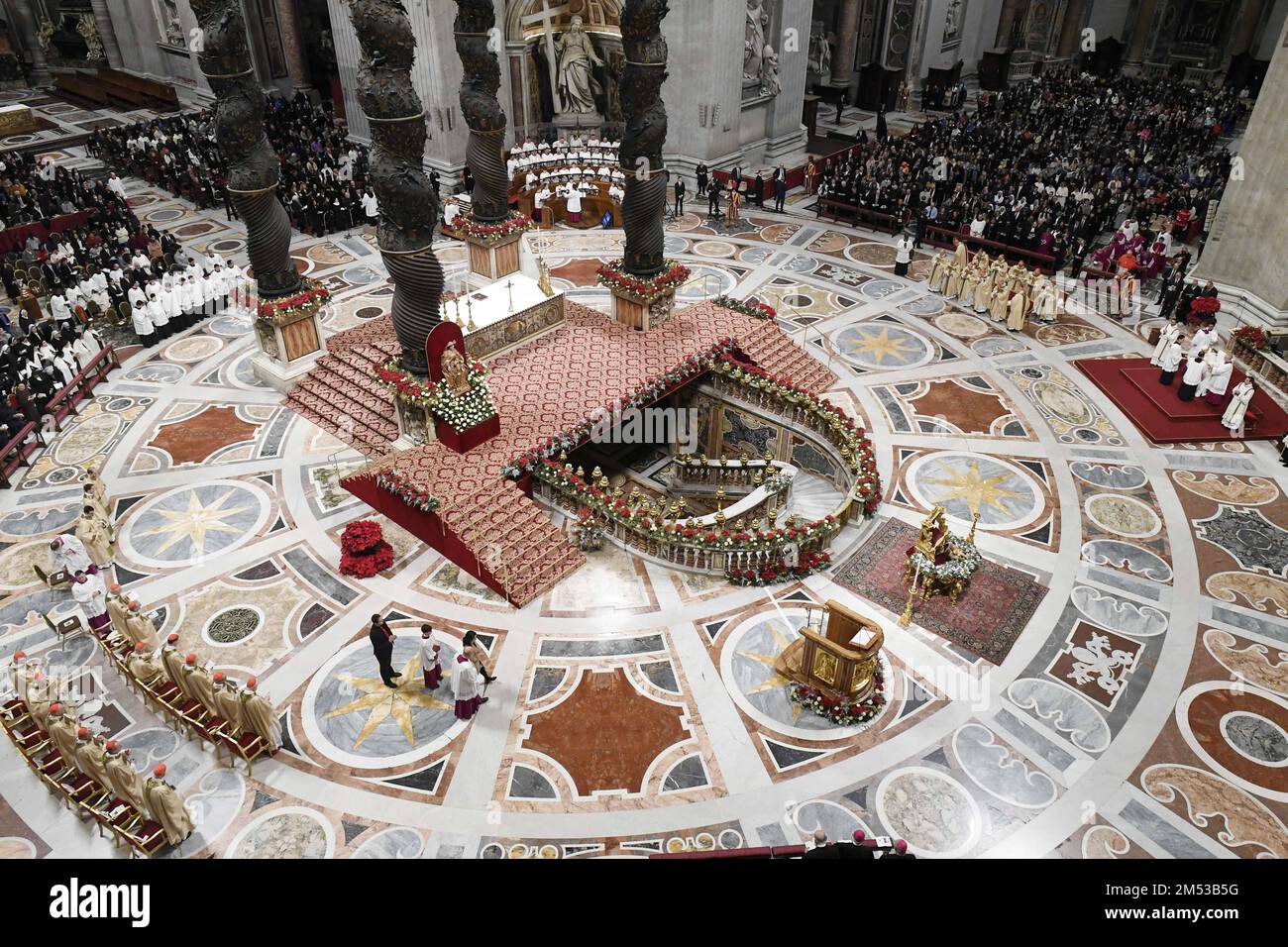 Pope Francis, in a wheel chair, celebrates the Christmas Eve mass at St ...
