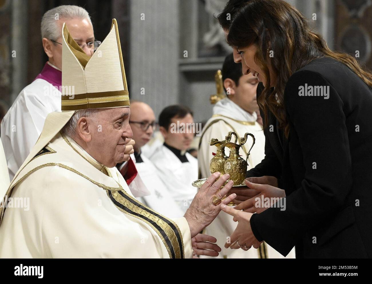 Pope Francis, in a wheel chair, celebrates the Christmas Eve mass at St ...