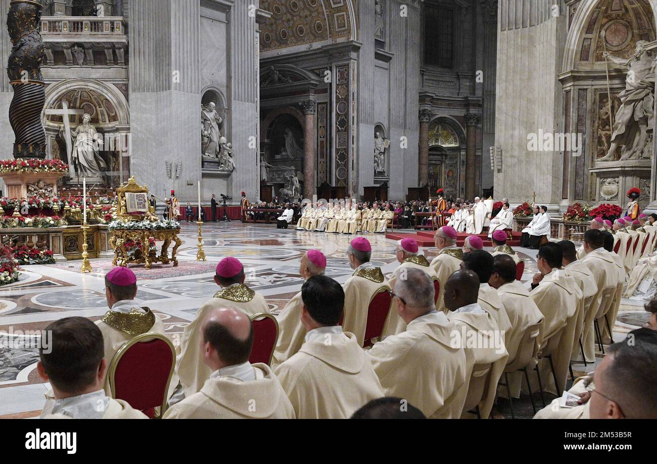 Pope Francis, in a wheel chair, celebrates the Christmas Eve mass at St ...