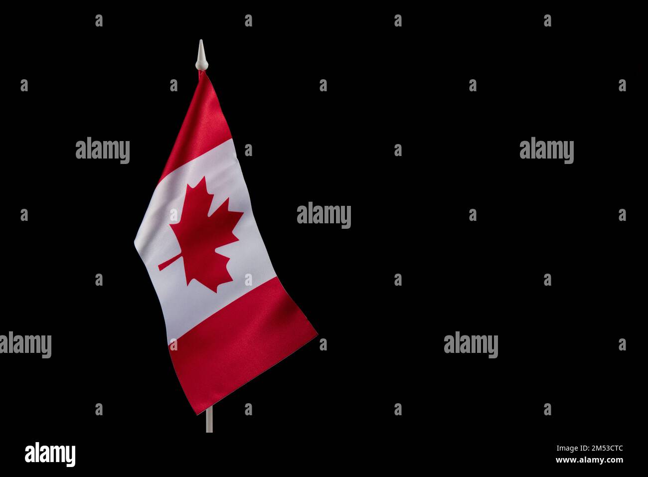 Small national flags of the Canada on a black background Stock Photo ...