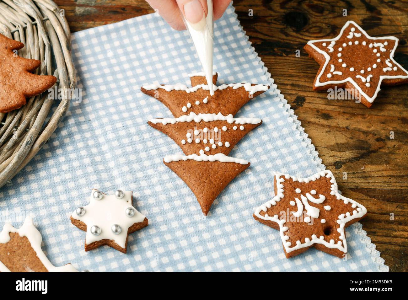Decorating gingerbread cookies for christmas. Steps of making biscuits ...