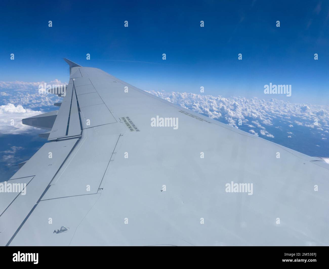 Travel by plane, view from plane window to wing, plane and outward view ...