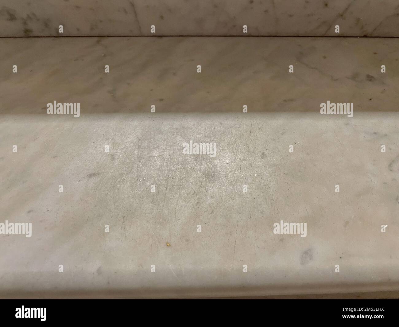 Scratched white marble step Stock Photo - Alamy