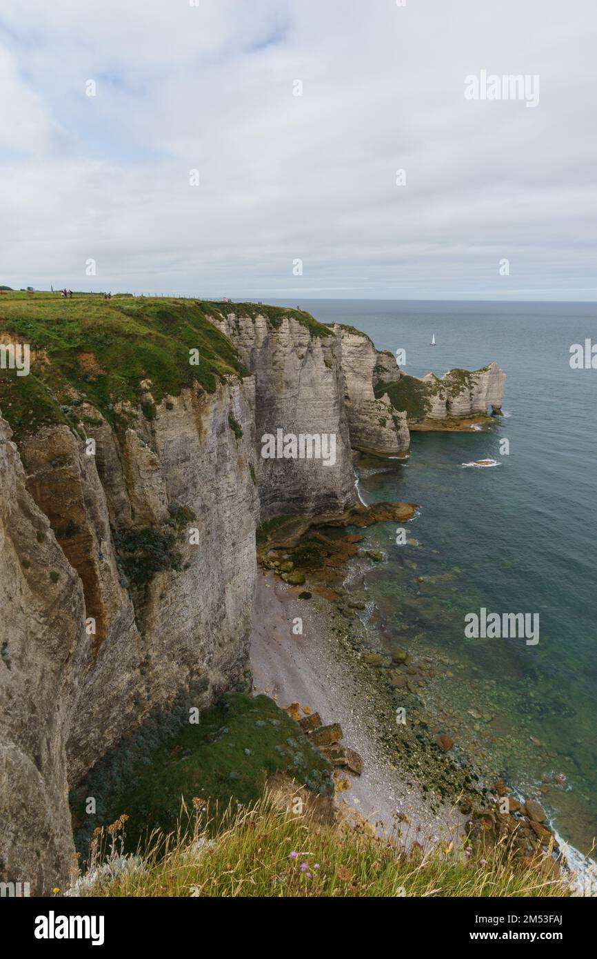 The cliff of Falaise d'Amont on a summer day in Etretat, Normandy ...
