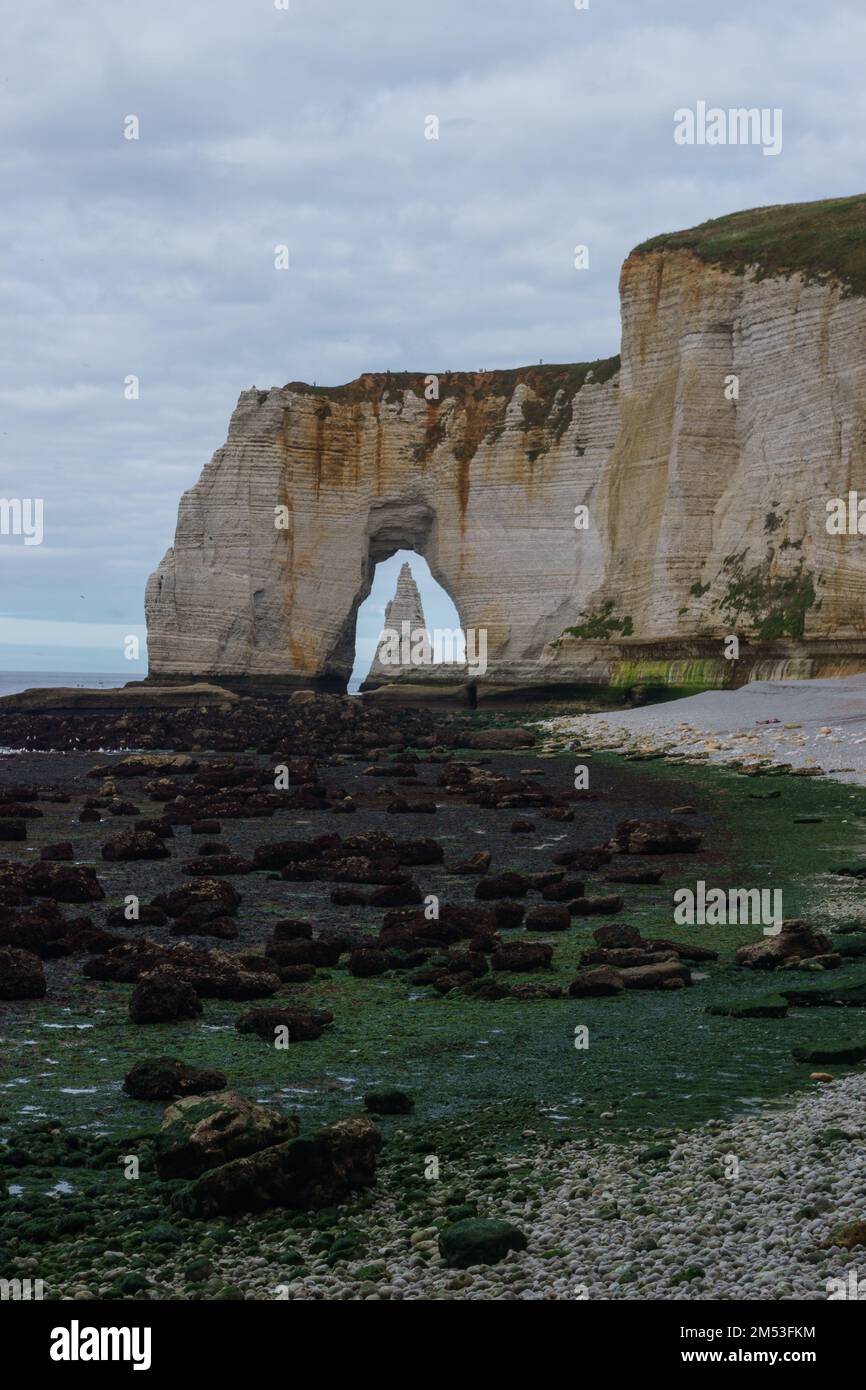The Needle seen through the arch of the Manneporte cliff at the ...