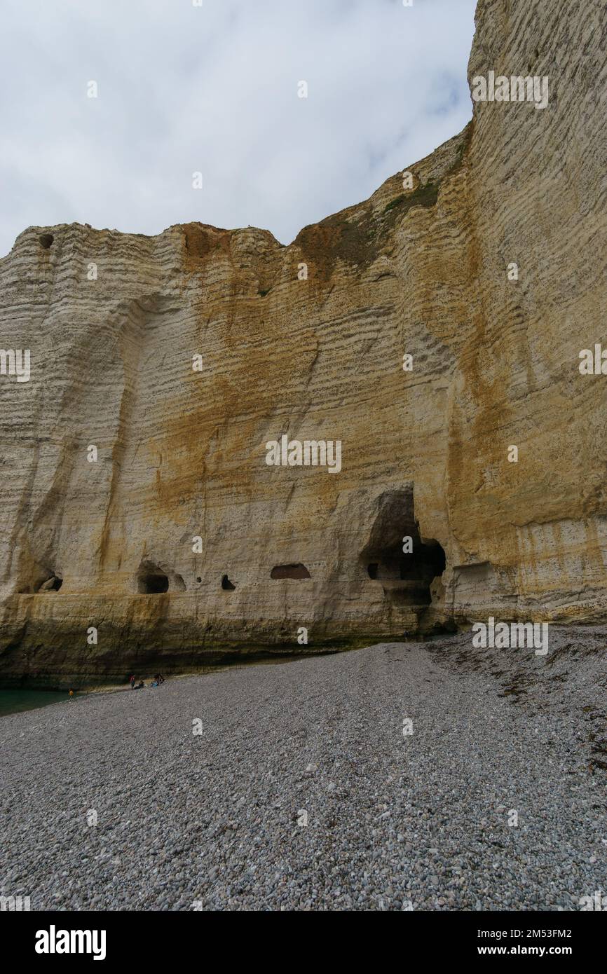 Rock formation on a cloudy summer day with tunnel as connection from ...