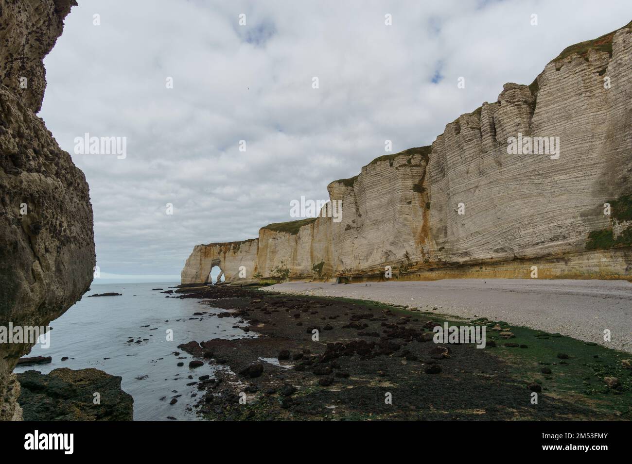 The Arch of Falaise la Manneporte at the Alabaster coast on a cloudy ...