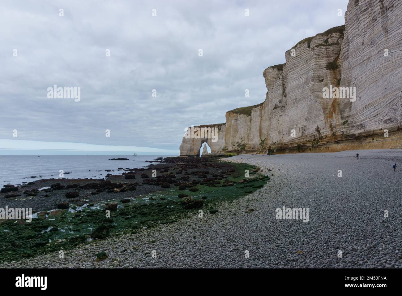 The Needle seen through the arch of the Manneporte cliff at the ...
