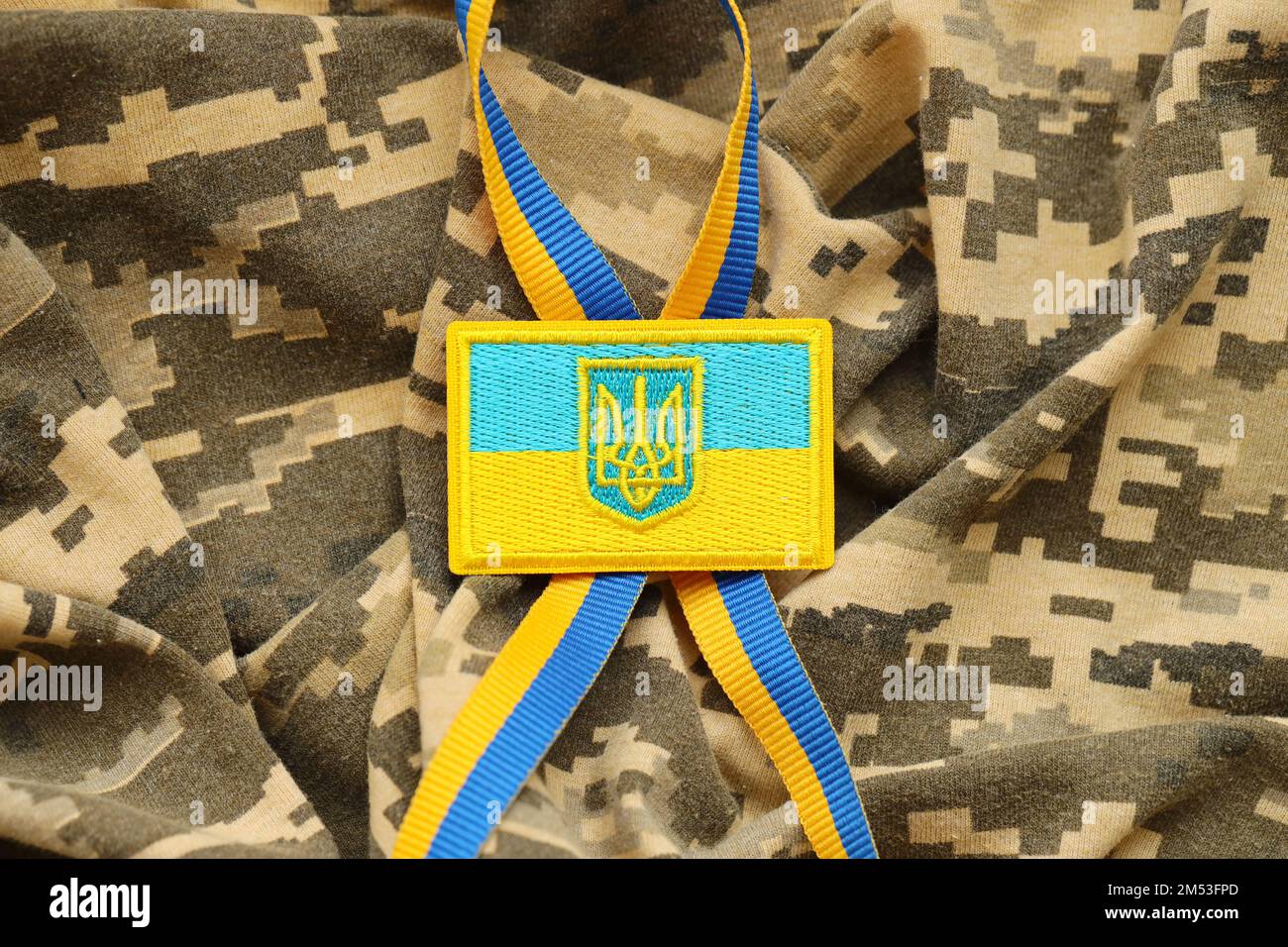 Pixeled digital military camouflage fabric with ukrainian flag and coat ...