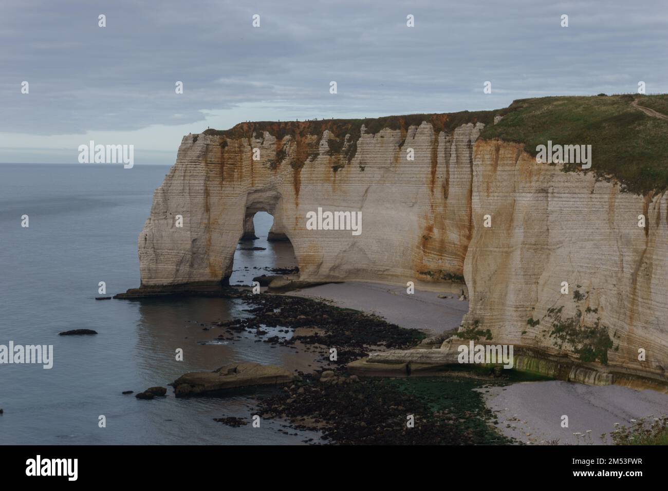 The arch of the Manneporte cliff with Porte d'Aval inside at the ...