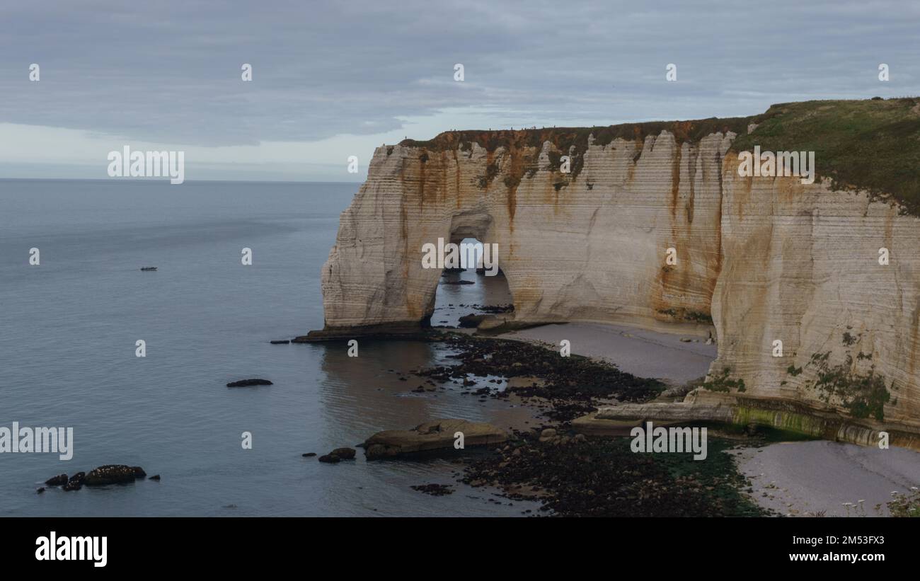 The arch of the Manneporte cliff with Porte d'Aval inside at the ...