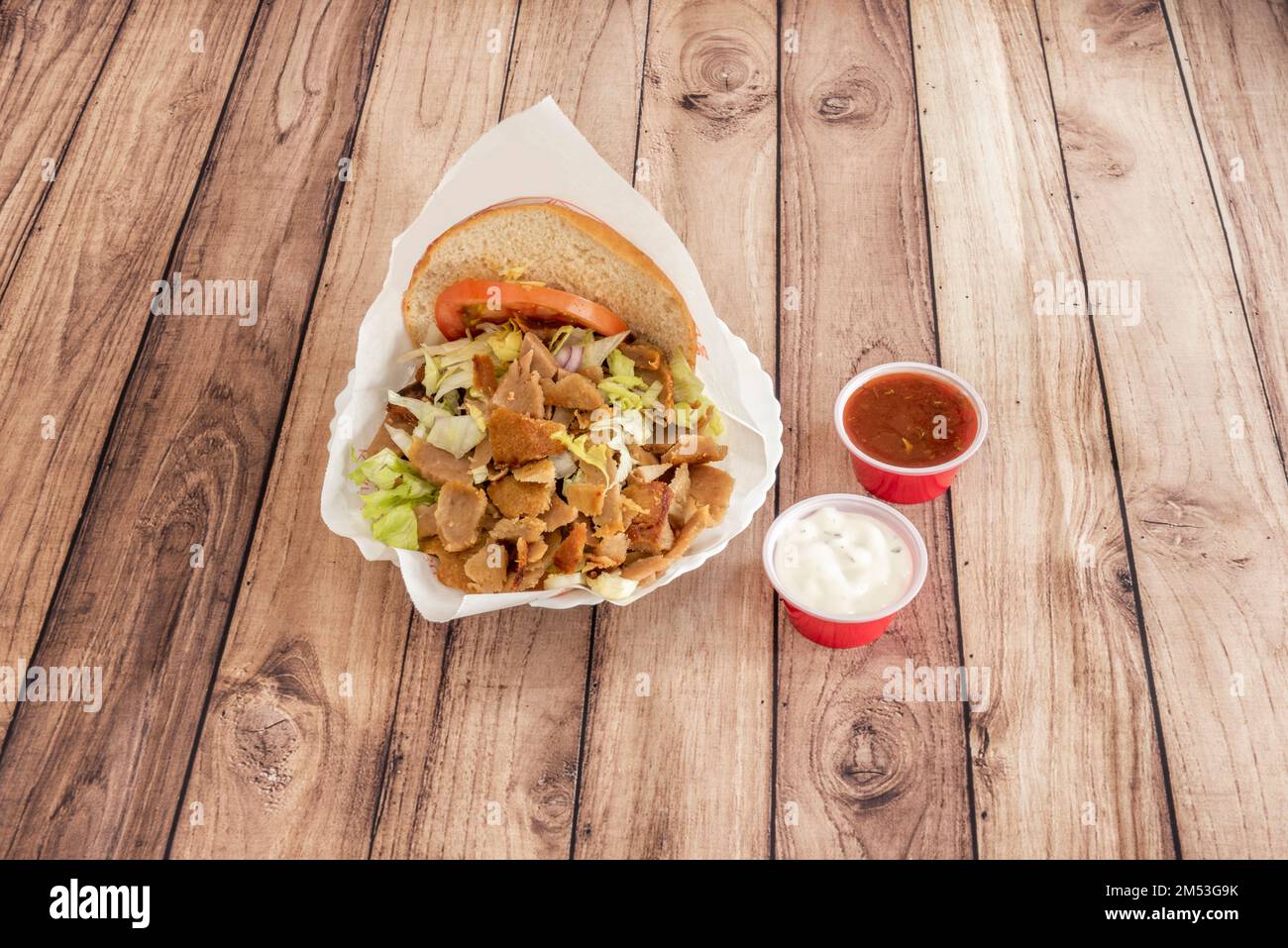 Typical sandwich of roast lamb kebab meat on a skewer in a European ...