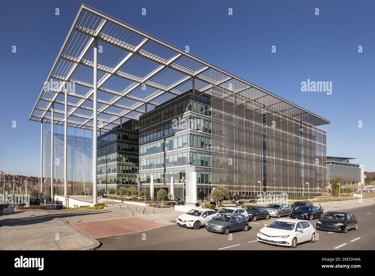 Corner facade of an office building with lots of glass and metal ...