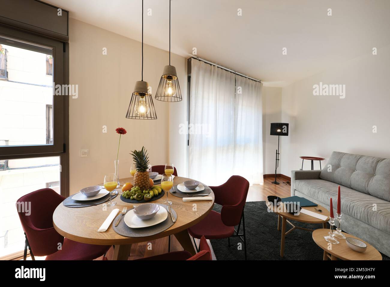 Living room of a vacation rental home with a circular wooden table with ...