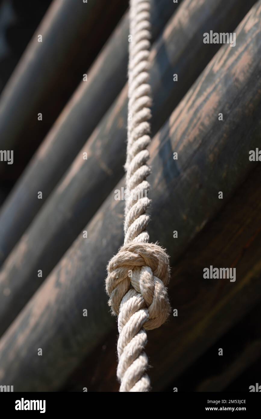 Rope with knots. Background with copy space for text Stock Photo - Alamy