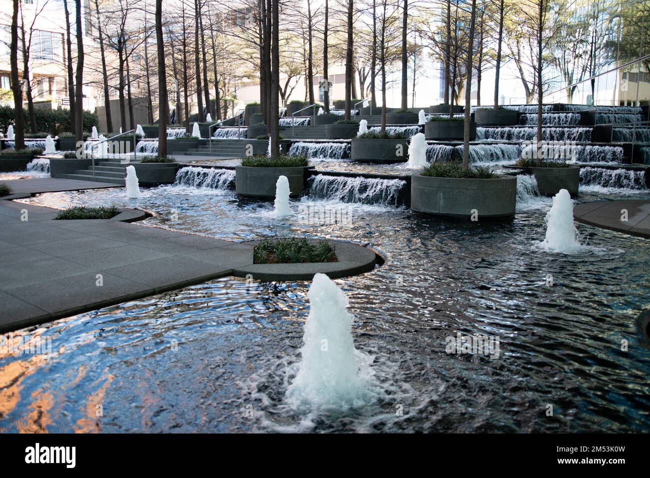 The beautiful small fountains with waterfalls in the park. Fountain Place, Dallas, Texas, USA ...